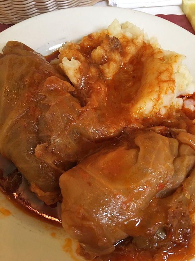 Comfort food that would make your grandmother nod in approval—tender cabbage embracing savory filling, swimming in rich, homemade gravy.