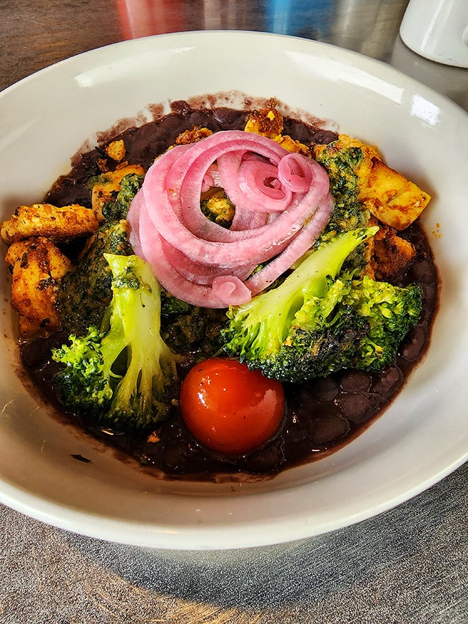 The Tofu Scramble laughs in the face of meat-eater skepticism—vibrant veggies, pickled onions, and black beans creating a colorful canvas of plant-based perfection.