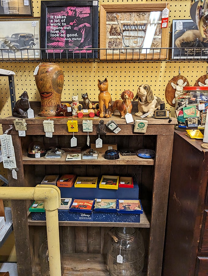 A menagerie of memories lines these shelves—from vintage pups to Andy Warhol wisdom. Each figurine is someone's childhood or collection cornerstone.