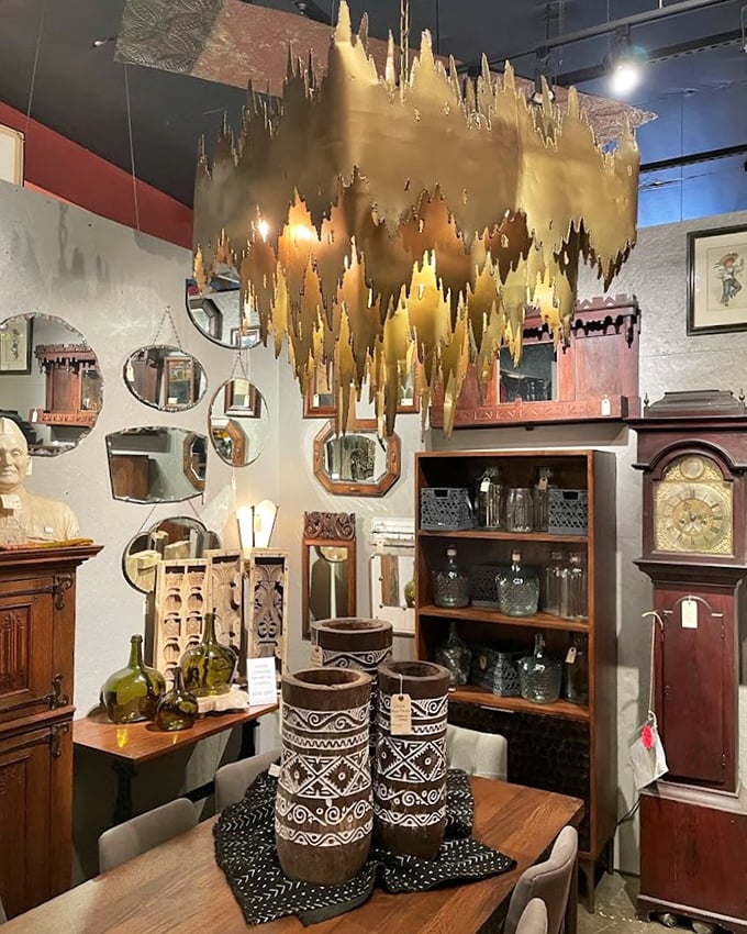 That gold chandelier isn't just lighting—it's jewelry for your ceiling, hovering above a collection that spans centuries of design history.