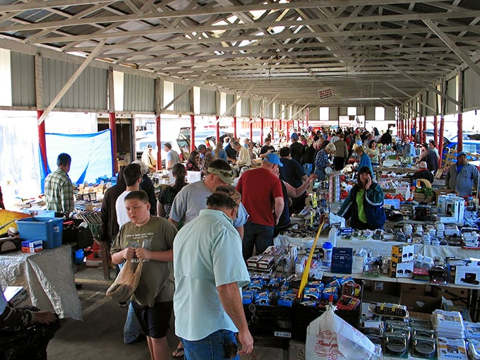 The weekend crowd navigates a sea of merchandise, each person on their own treasure hunt through this bustling marketplace.