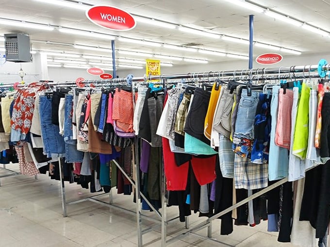 The women's clothing section – organized chaos at its finest. Like a rainbow decided to collaborate with a fashion magazine from every decade.