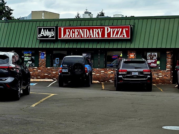 That green and brick exterior houses decades of pizza wisdom – some legends are built one slice.
