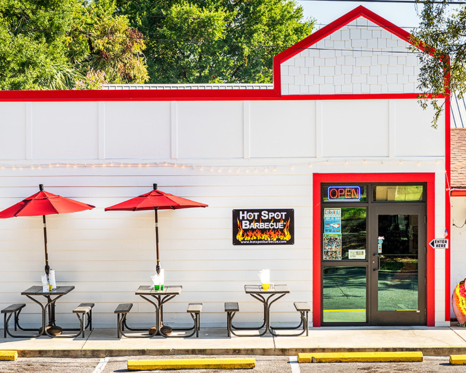 The cheerful red and white building practically shouts "come on in for some serious barbecue fun!"