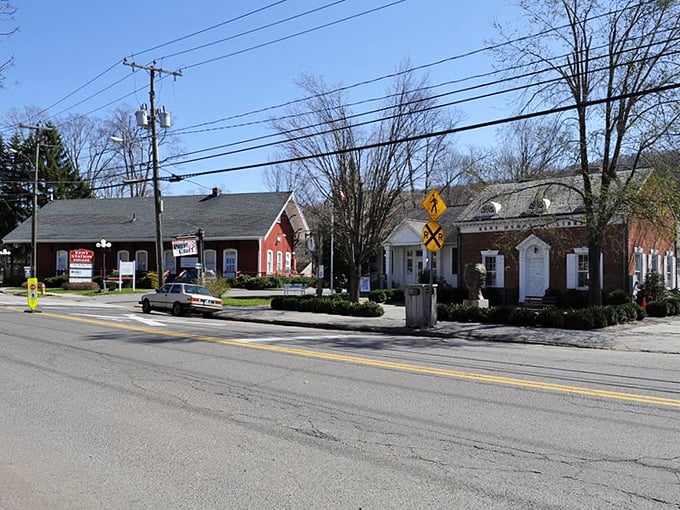 Railroad crossings and red buildings create the perfect backdrop for Connecticut's most photogenic small town.