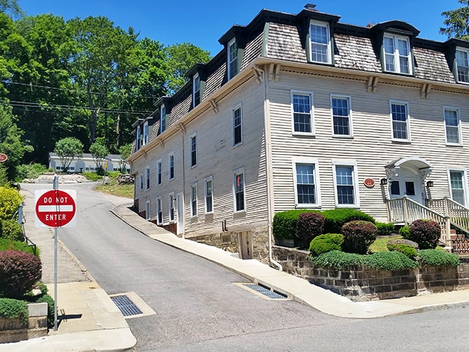 That classic three-story corner building holds stories in every brick, the kind of place where real people live real lives.