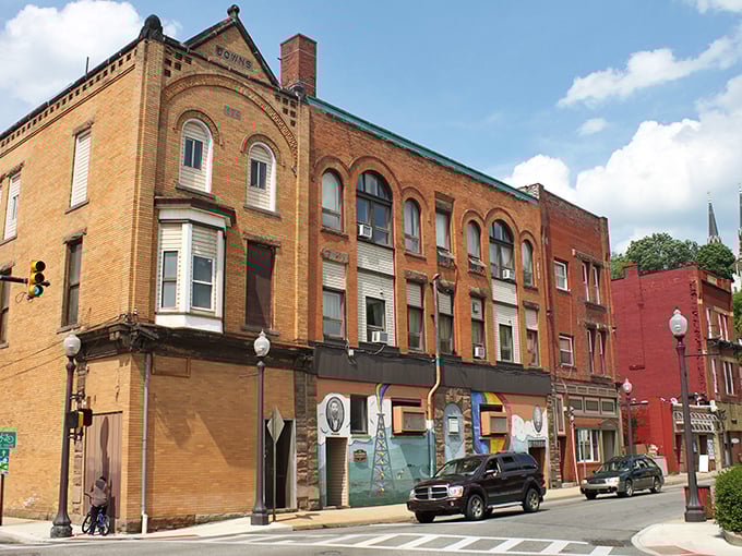 Oil City's historic buildings blend artistic murals with affordable apartments above. Like finding an undiscovered diner with five-star food at fast-food prices—beauty and bargains in one package!