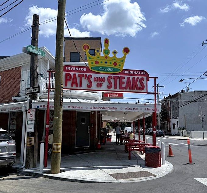 That crown isn't just decoration—it's a statement. The 24-hour corner spot that launched a thousand imitations.