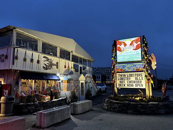 Petey's Summertime Seafood's sign glows like a lighthouse for hungry travelers. Those colorful buoys aren't just decoration—they're a promise of ocean-fresh delights.