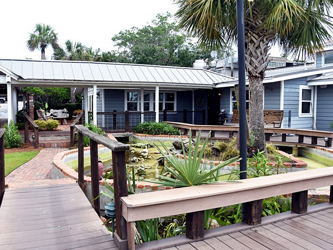 Brick walkways winding past tropical ponds and palm trees – this coastal spot feels like a mini-vacation before you even eat.