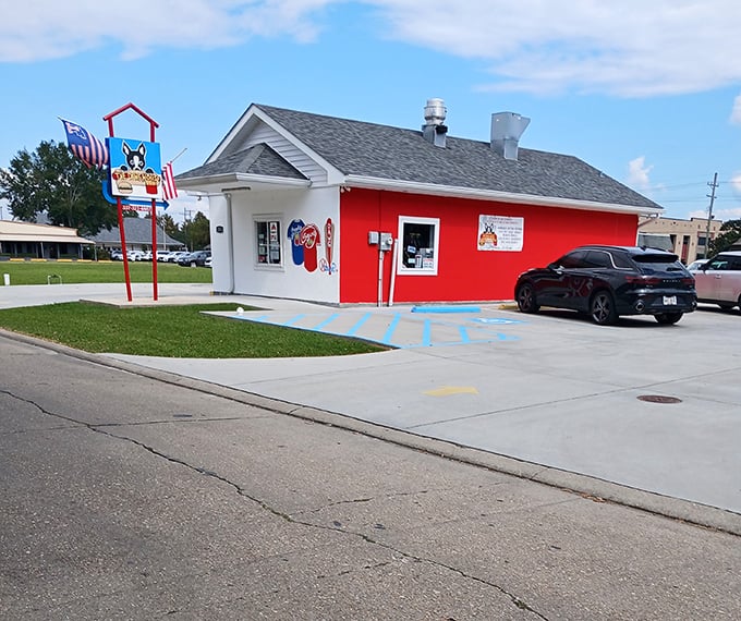 That bright red building isn't just eye-catching—it's a beacon of hot dog happiness in New Iberia.