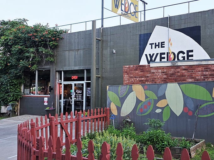 The Wedge's colorful garden fence hints at the fresh ingredients and creative spirit inside. Where pizza meets urban farming in the heart of OKC.