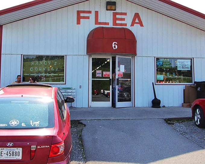 The classic white-and-red facade of Tri-Cities Flea Market promises treasures inside – like a present waiting to be unwrapped.