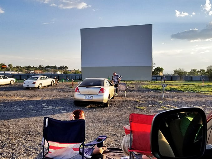 Under the golden afternoon sun at Delta’s Tru Vu Drive-In, families set up chairs and blankets, getting ready for a classic night of movies under the open sky.