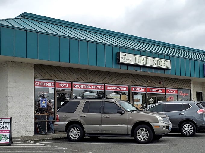The teal accents of Bella's Voice Thrift Store pop against the building's exterior, promising fresh finds inside.