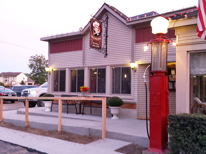 Bone Heads' vintage gas pump and welcoming porch say "slow down and stay awhile" – the universal language of proper BBQ joints.