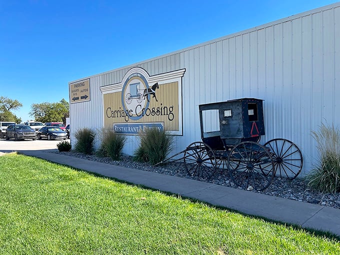 The antique carriage display at Carriage Crossing sets the perfect scene. Come for the ambiance, stay for the legendary cinnamon rolls.
