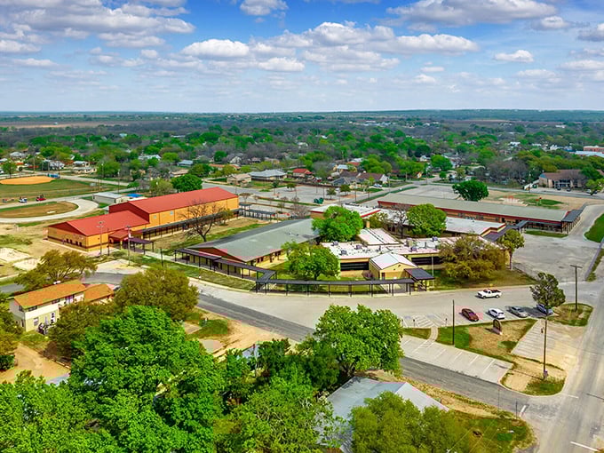 An aerial view of Castroville shows how the town nestles perfectly between the Medina River and rolling Hill Country terrain.