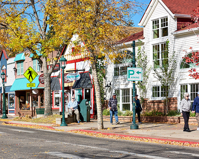 Fall brings a golden glow to Estes Park’s charming downtown, where crisp air and colorful shops invite a leisurely wander.