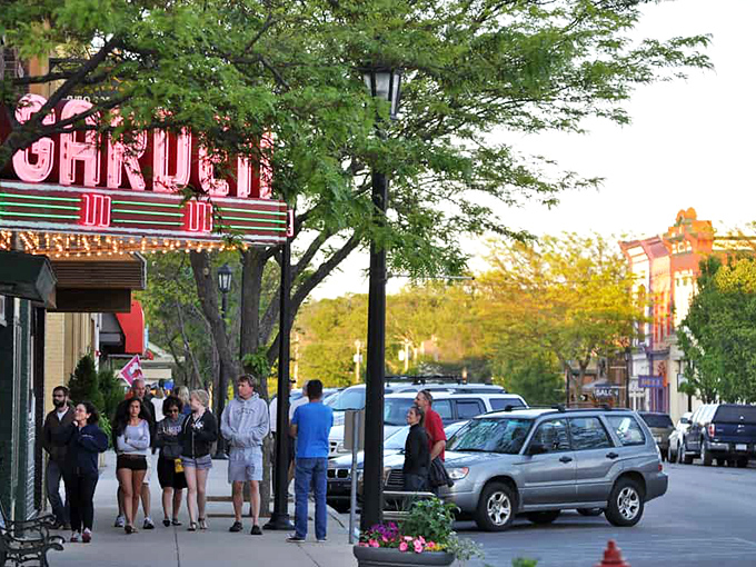 The historic Frankfort theater marquee glows, promising entertainment the way it used to be – communal and magical.