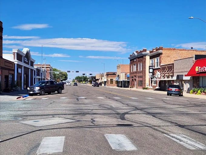 Wide streets stretch toward the horizon where historic storefronts meet endless Nebraska prairie views.