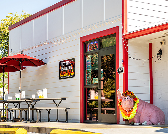 That friendly pig mascot knows what's up - this is where Pensacola comes for authentic barbecue joy.