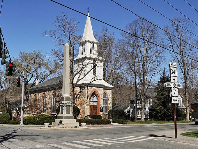 That classic white steeple rising above the trees says "New England" louder than any postcard ever could.