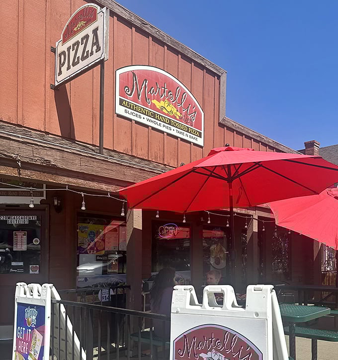 Those picnic tables outside aren't just seating – they're front-row seats to Sisters' best dinner show.