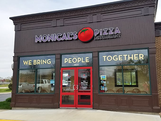 Monical's bright red doors swing open to a world where pizza brings folks together better than a family reunion.