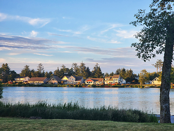 Morning light dances across Ocean Shores' lakeside homes like nature's own reality show—"Lakefront Bargain Hunt: Retirement Edition" with a Pacific Northwest twist!