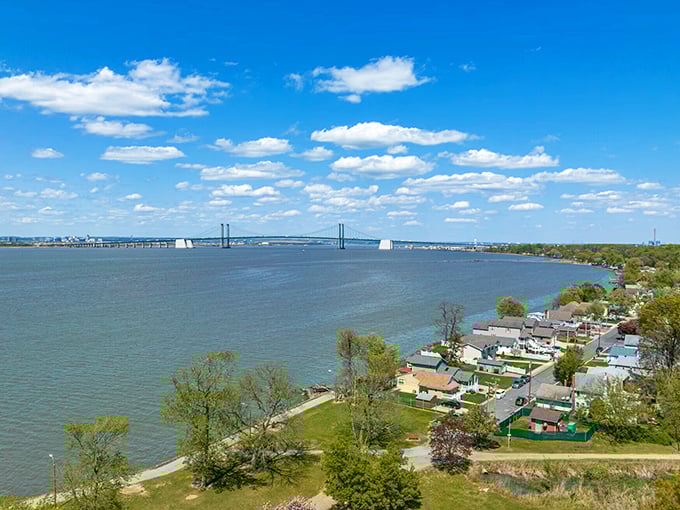 The Delaware Memorial Bridge stands sentinel over Pennsville's waterfront homes, where morning coffee comes with million-dollar views.