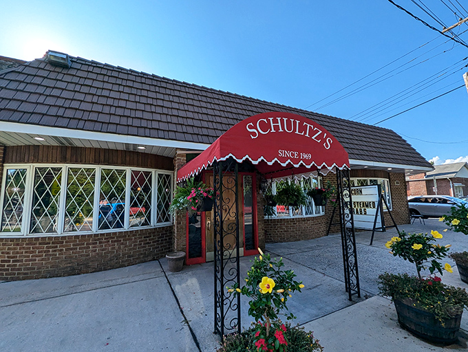 Schultz's charming brick exterior hides decades of crab-cracking wisdom. That red awning might as well be a superhero cape.