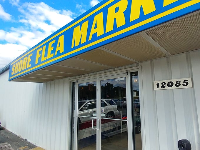 Shore Flea Market's bold blue sign promises coastal treasures. A beacon for bargain hunters on Virginia's Eastern Shore!