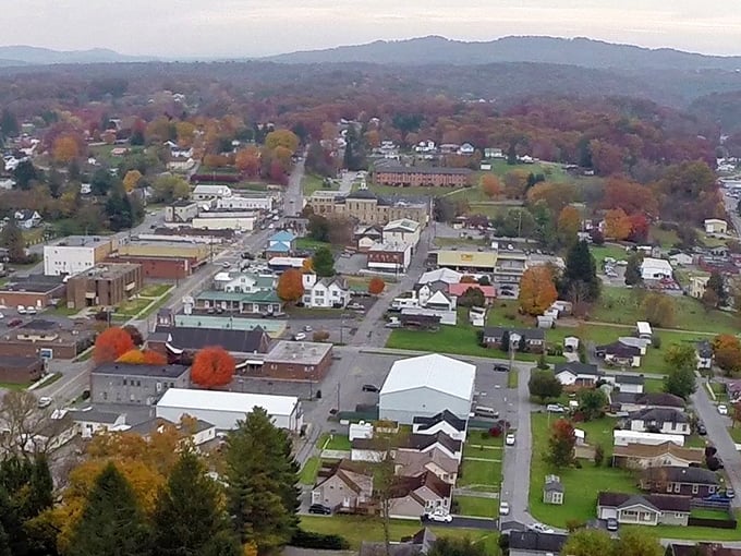 Fall foliage frames Summersville like nature's own Instagram filter—these hills dress to impress when autumn comes calling!