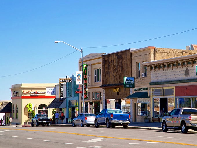 The Grand Cafe beckons hungry travelers along Susanville's sun-drenched promenade—a frontier town that's traded dusty boots for pickup trucks.