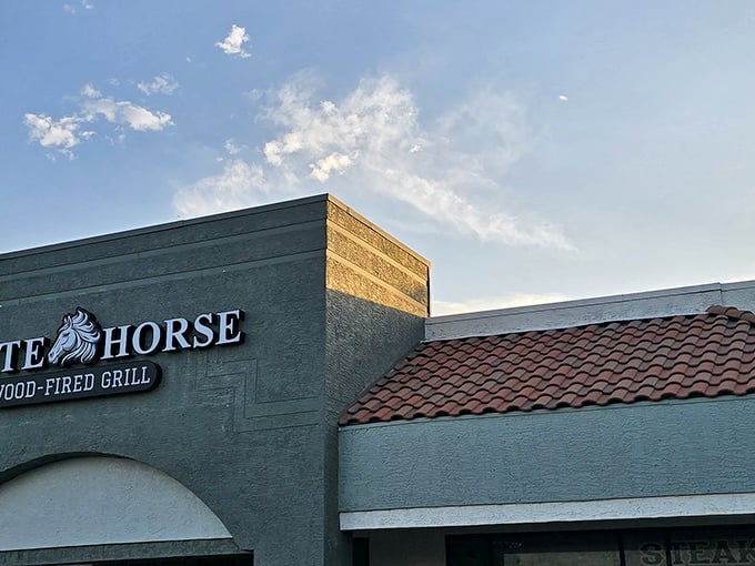 White Horse Wood-Fired Grill: As the Arizona sunset casts warm light on the façade, the real fire is inside—where wood-fired flavors come to life.