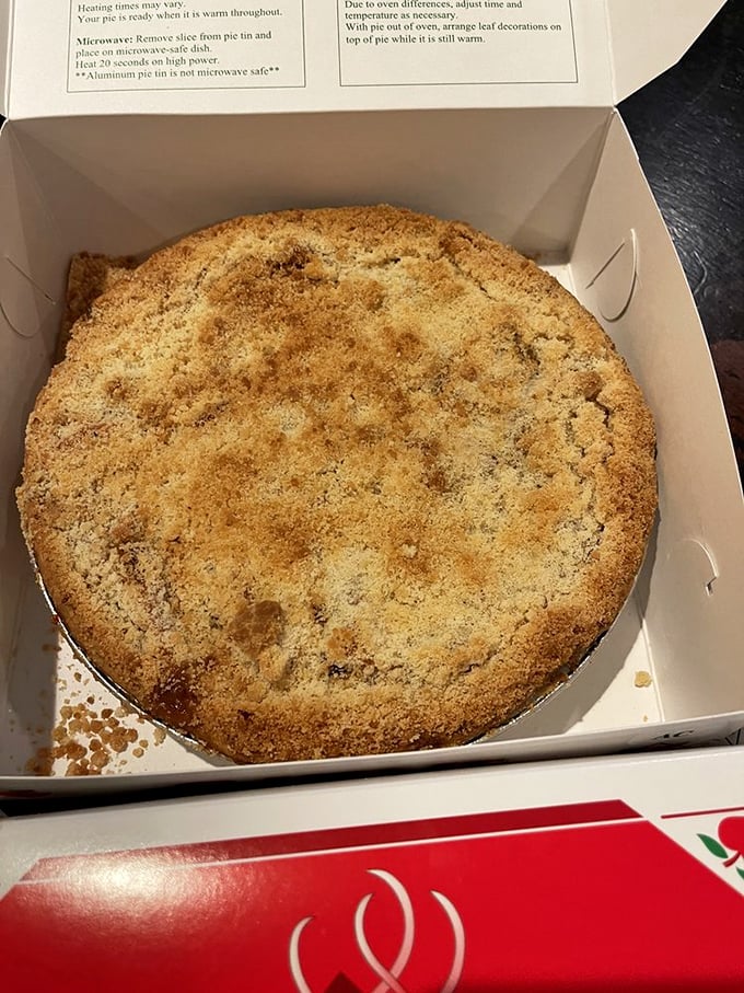 The apple crumb pie's buttery streusel topping is what cinnamon-sugar dreams are made of – crumbly, golden, and utterly irresistible.