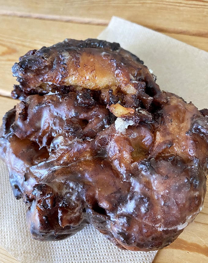 Not all heroes wear capes – some, like this apple fritter, wear a glorious glaze and hide chunks of cinnamon-kissed fruit within their craggy landscape.