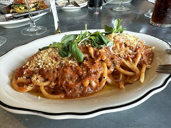 Who knew pasta could look so at home in a British pub? This bucatini brings Mediterranean flair to the table with a generous sprinkle of basil.