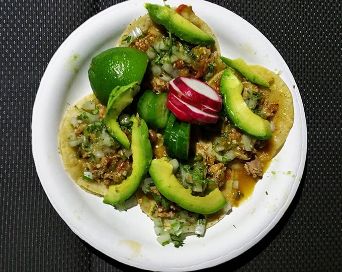 Fresh avocado slices transform an already excellent taco into something transcendent. Green gold atop savory treasure.