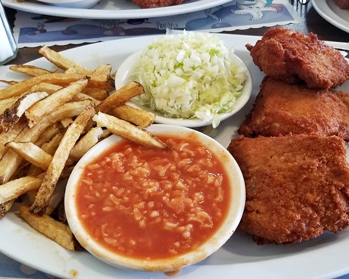 The distinctive rice-flecked hot sauce isn't just a condiment – it's a cultural statement, a tangy counterpoint to the richness that makes Barberton chicken legendary.