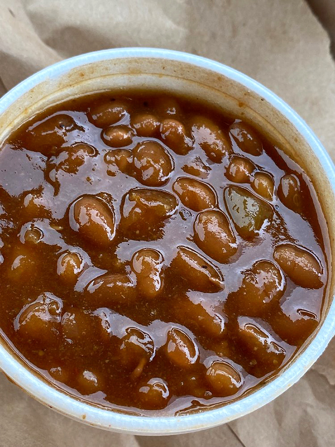 These baked beans have clearly been attending flavor seminary – each spoonful preaches the gospel of molasses and smoke.