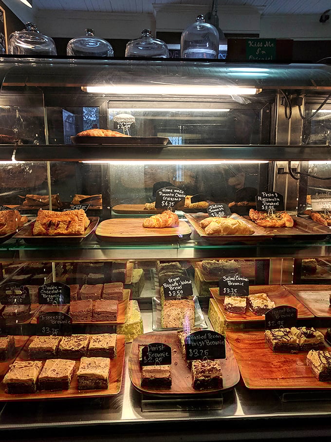 The display case – or as I call it, "The Museum of Delicious Art" – where every brownie deserves its own velvet rope.