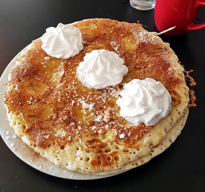 These aren't just pancakes—they're fluffy golden discs of joy topped with whipped cream clouds. Breakfast that makes you forget all your troubles.