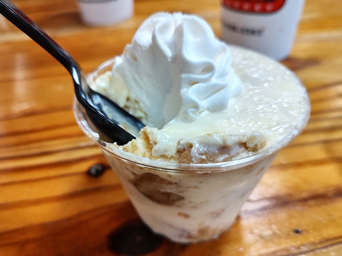 The banana pudding arrives like a sweet southern handshake after the savory main event—creamy, nostalgic, and utterly necessary.