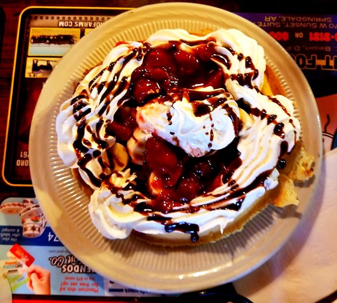This isn't just dessert—it's an architectural marvel of whipped cream, chocolate, and cherries that makes you question why we don't eat dessert for breakfast.
