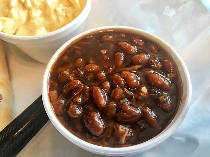 Bean theology at its finest. These aren't your campfire beans—they're complex, sweet-savory nuggets swimming in a sauce that deserves its own fan club.