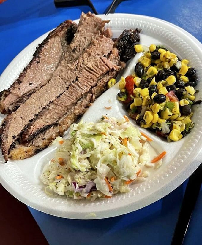 Brisket sliced thin with that telltale pink smoke ring—the barbecue equivalent of finding the Hope Diamond in your backyard.