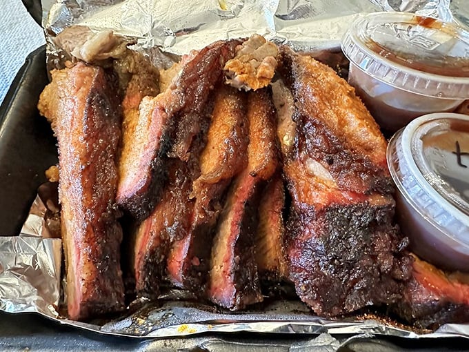 Brisket with that coveted pink smoke ring—barbecue's equivalent of Olympic gold. The slice reveals hours of patient, loving smoke work.