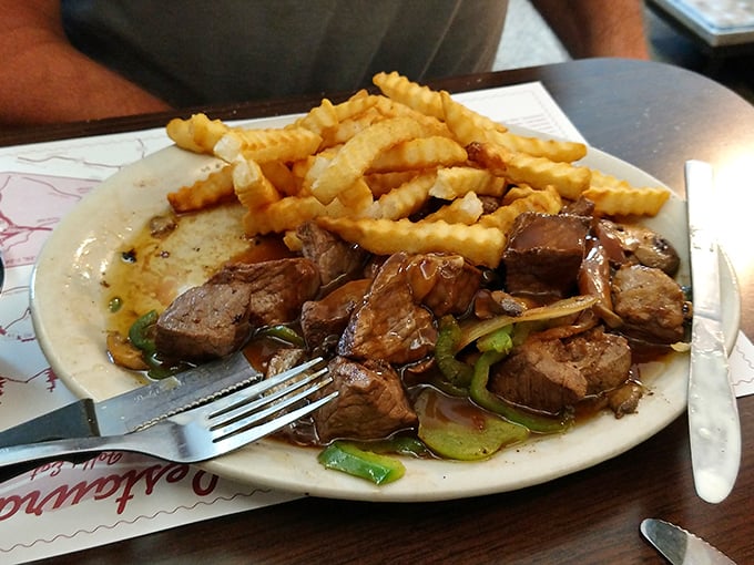 Tender beef tips swimming in savory gravy alongside golden fries – proof that sometimes the simplest combinations create the most profound happiness.